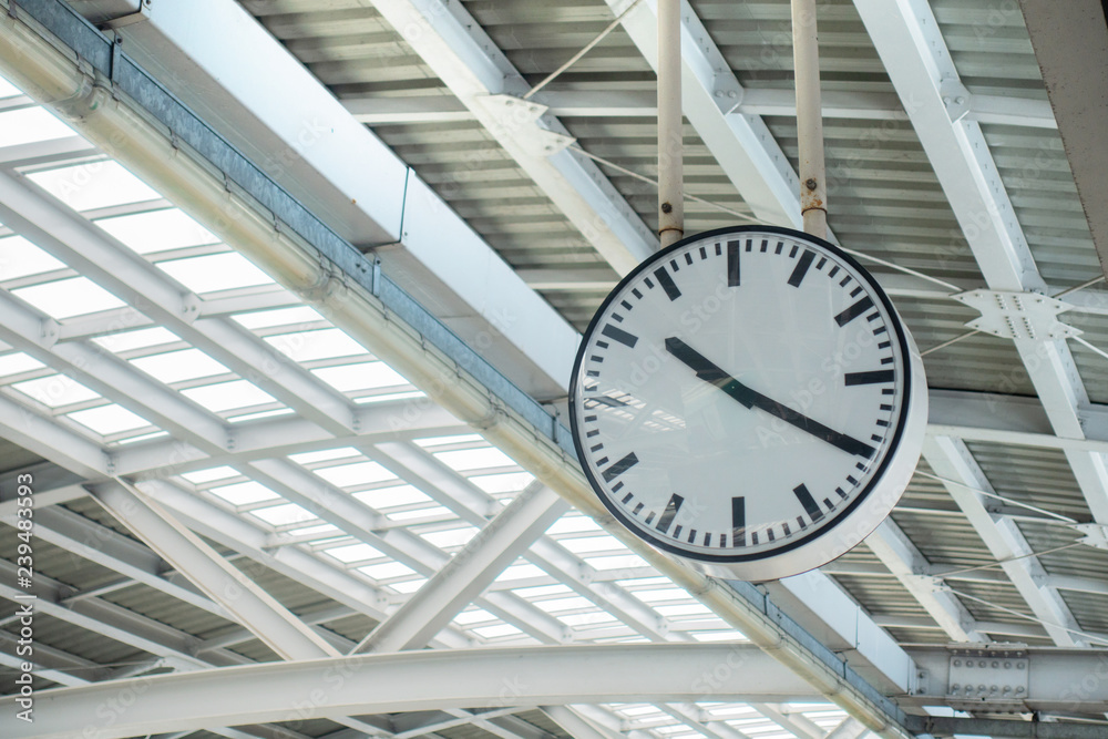 Clock at the railway station for passenger looking the time with metal ...
