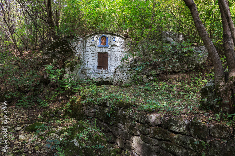 The holy spring of living water, the old 17th century font, moss ...