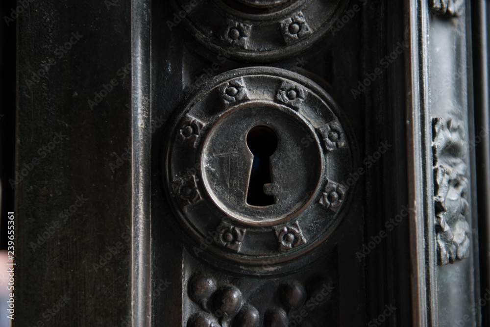 Keyhole on an ancient architectural door of an old church. The brass ...