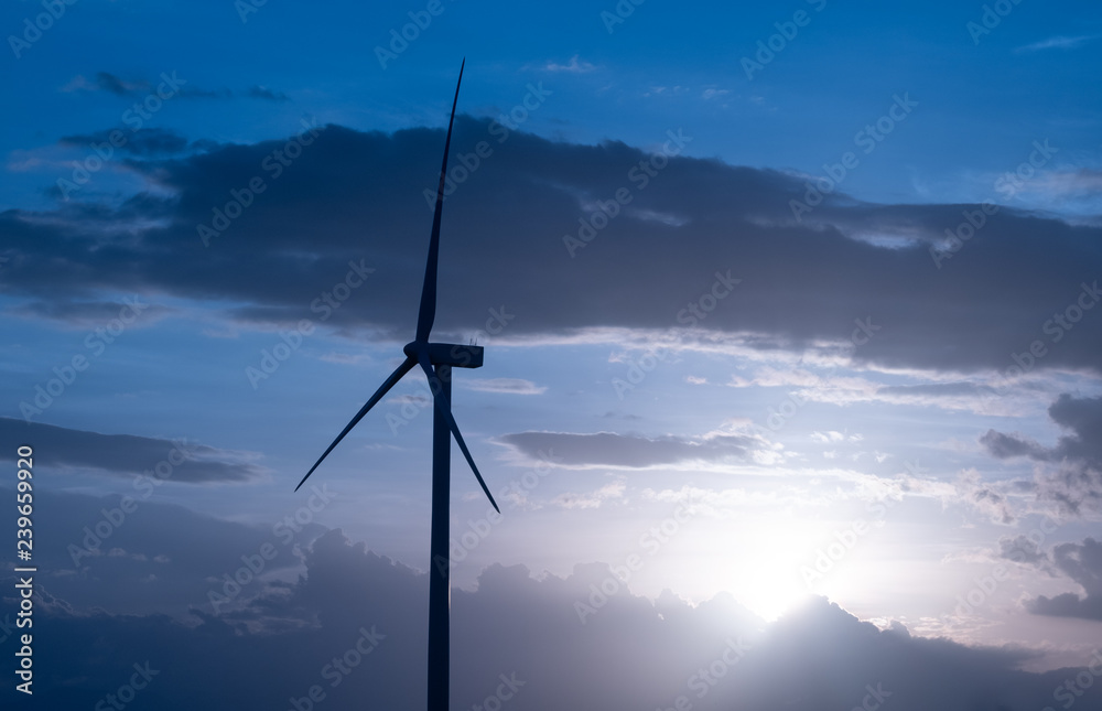View up, bottom view of wind turbine, windmill isolated on blue sky ...