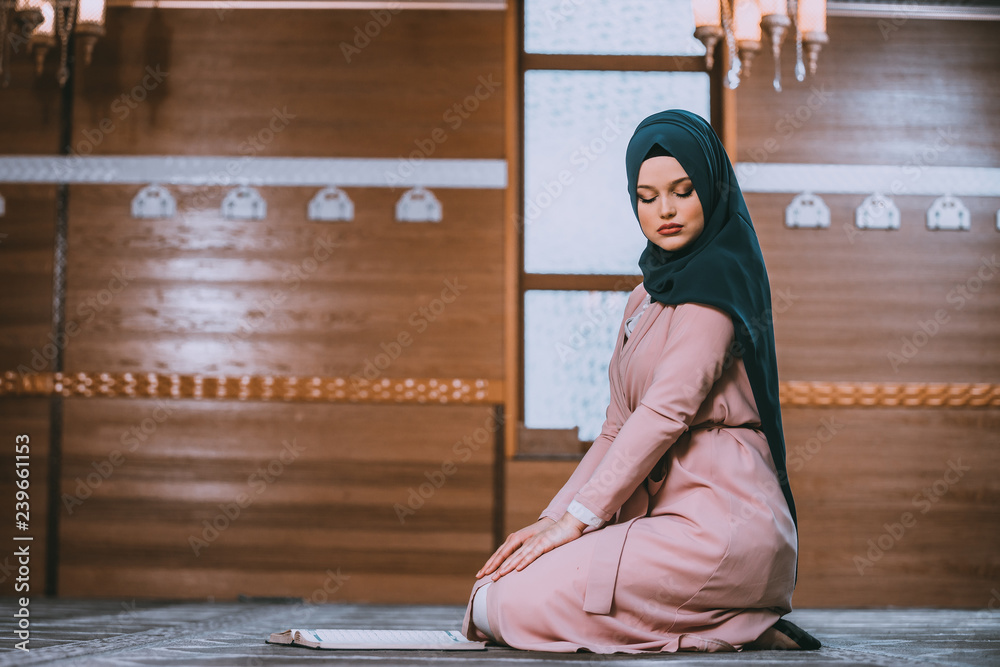 muslim woman praying in mosque Stock Photo | Adobe Stock