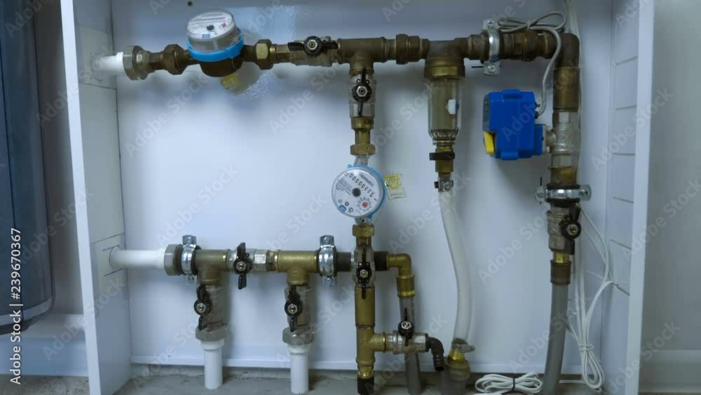 White box with a water distribution system in a residential building ...