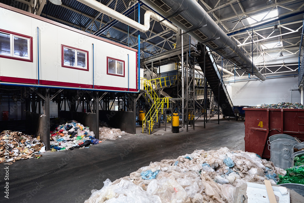 Department of manual waste sorting at modern waste plant with conveyor ...