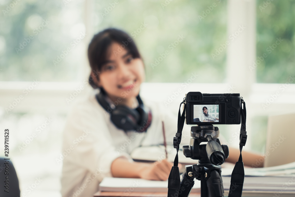 Happy young Asian singer woman beauty blogger or vlogger recording ...