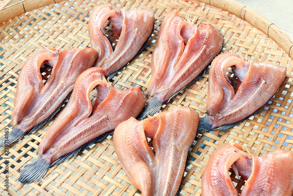 striped snakehead fish on bamboo threshing basket in air sun for dried ...