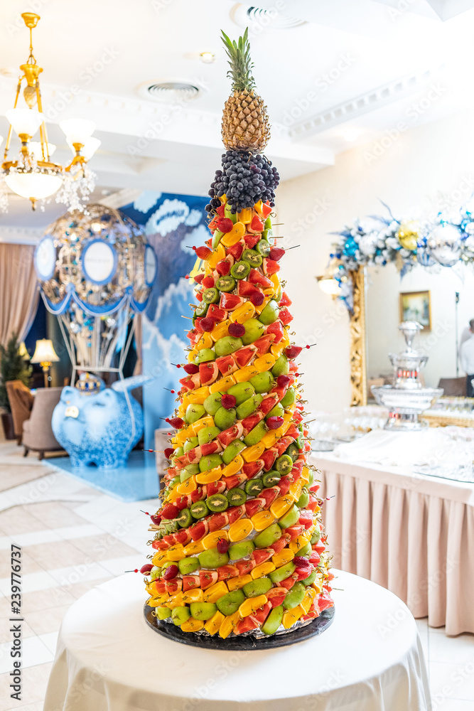 tropical fruits cut thtower of chopped tropical fruits and strawberries ...