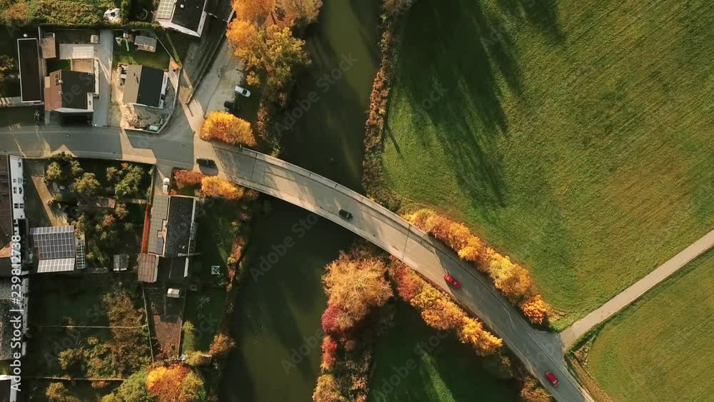 Aerial top view of country road crossing a river Stock Video | Adobe Stock