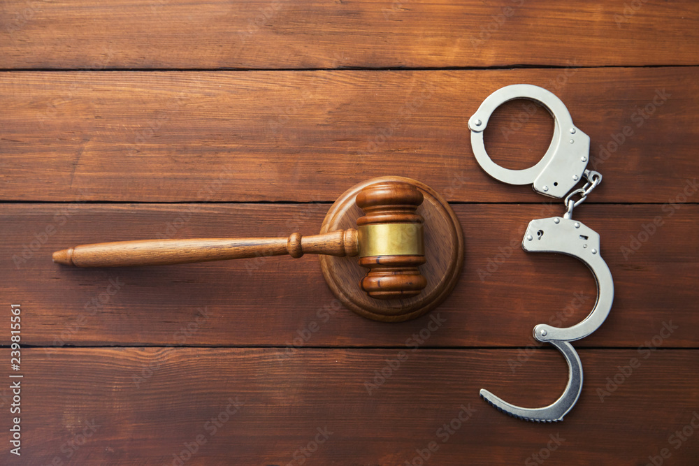 judge with handcuffs Stock Photo | Adobe Stock