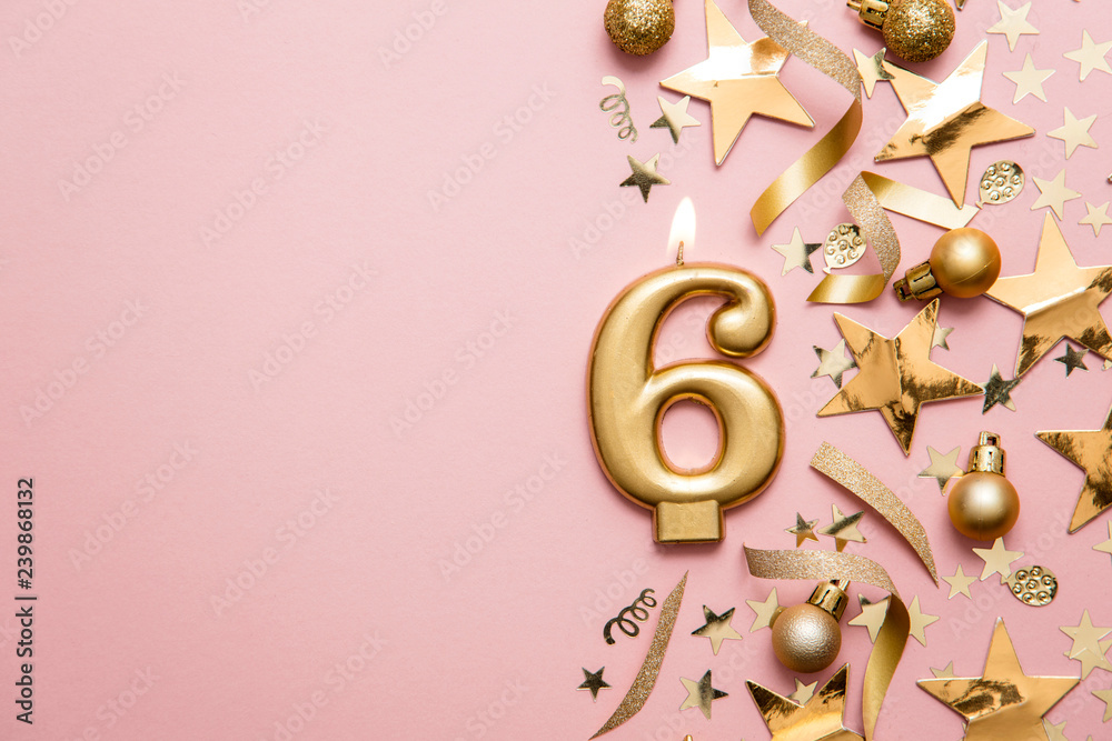 Number 6 gold celebration candle on star and glitter background Stock ...