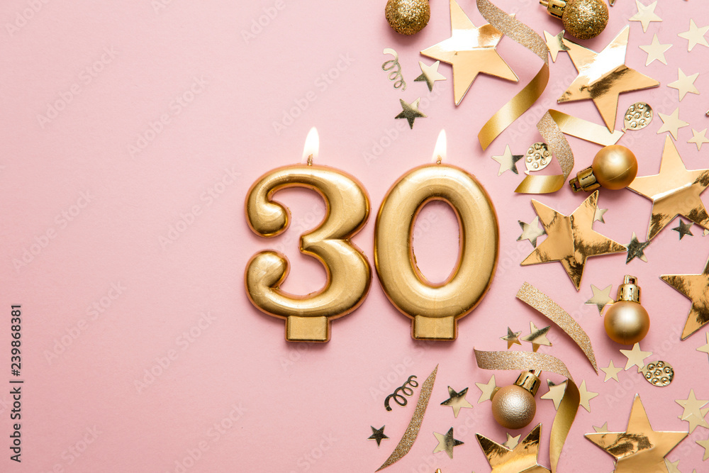 Number 30 gold celebration candle on star and glitter background Stock ...