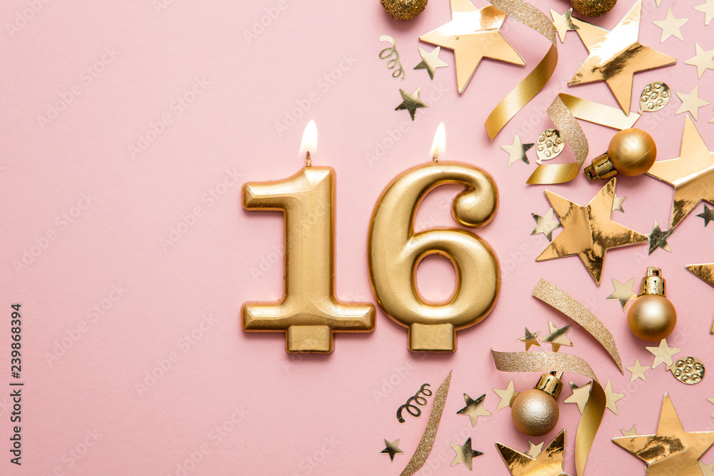 Number 16 gold celebration candle on star and glitter background Stock ...