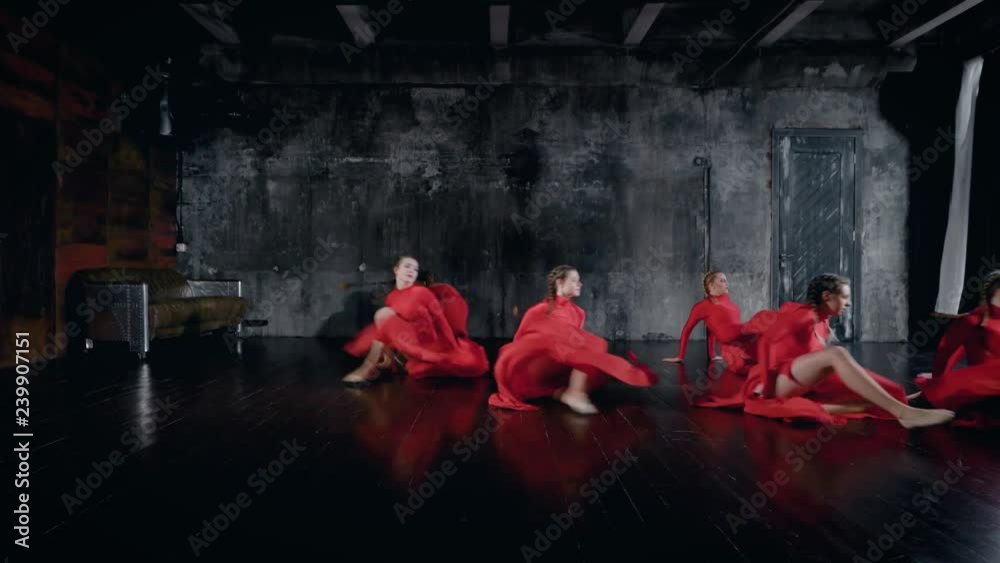 teenage girls are performing dance in a rehearsal room, wearing red ...