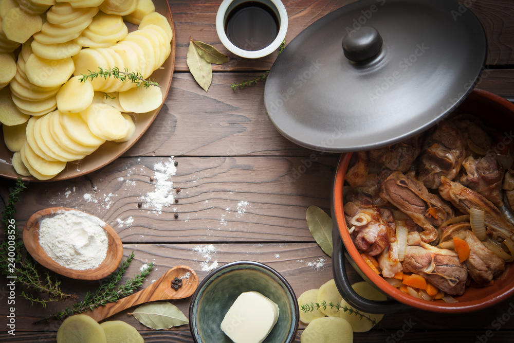 Cooking Lancashire hotpot - a stew consists of lamb, onion, carrot ...
