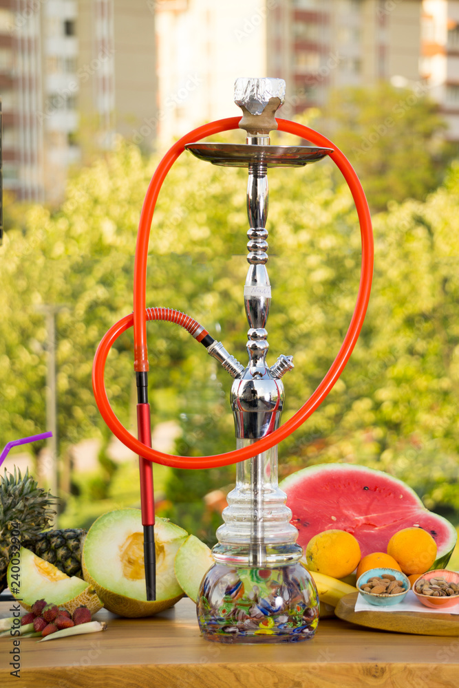 East smoking hookah. Arabian shisha with fruits. Hookah and apple ...