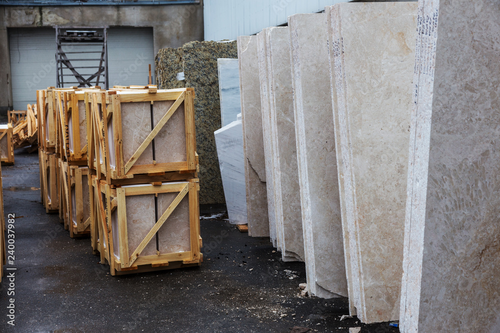 Side view of the edge of the granite slab in bulk. A stack of granite ...