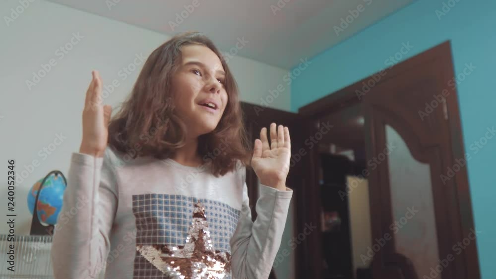 hide and seek. little girl covered her eyes face with her hands peek a boo waiting for a ...