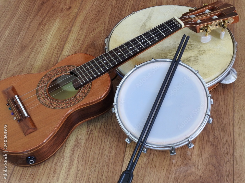 Three Brazilian musical instruments: cavaquinho, pandeiro (tambourine ...