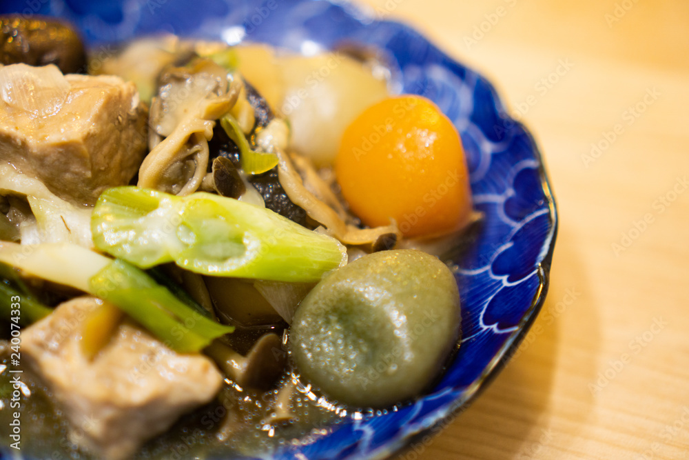 Imoni in a dish (Imoni is a type of taro and meat soup eaten ...