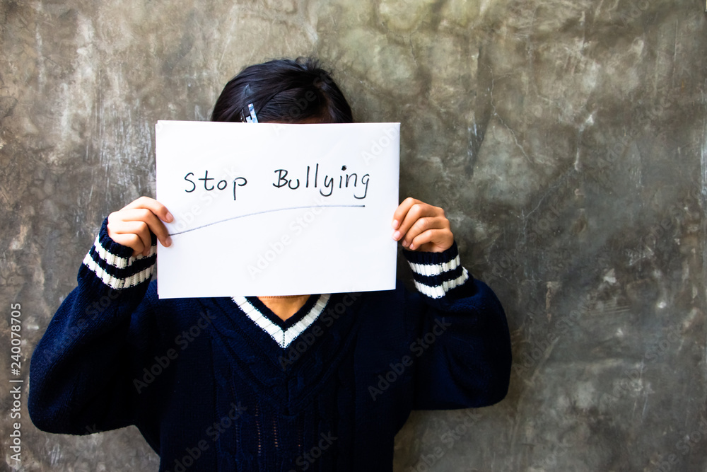 Girl with Stop Bullying sign, Stop bullying concept. Bullying is ...