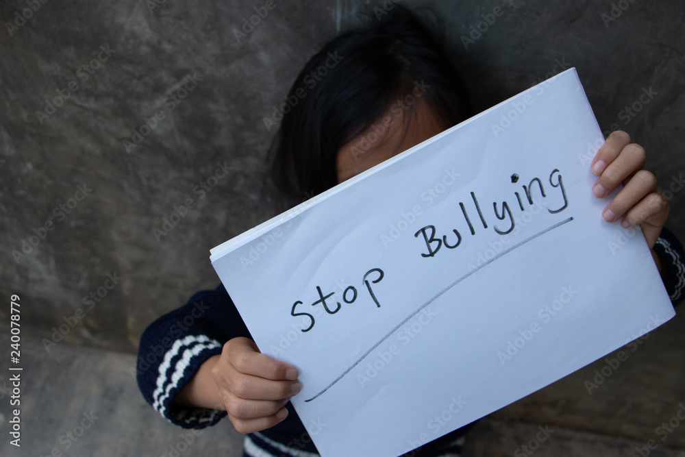 Girl with Stop Bullying sign, Stop bullying concept. Bullying is ...