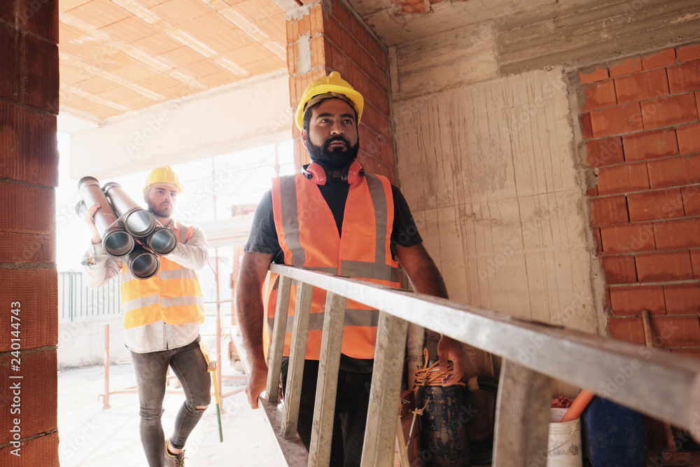 Workers In Construction Site Using Tools And Heavy Equipment Stock ...