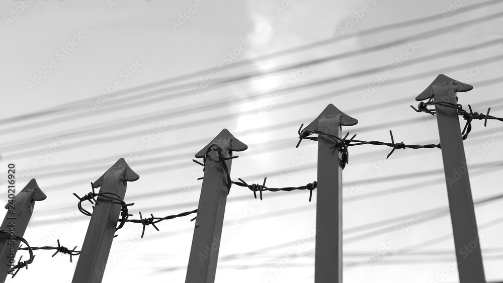 Barbed Wire Surround Steel Arrow and High Fence, Look at Sky, Detained ...