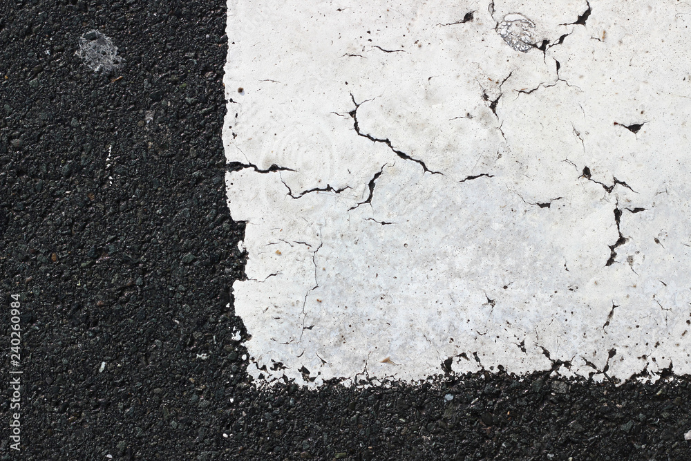 Asphalt pavement sign marking crosswalk white paint wet old surface ...
