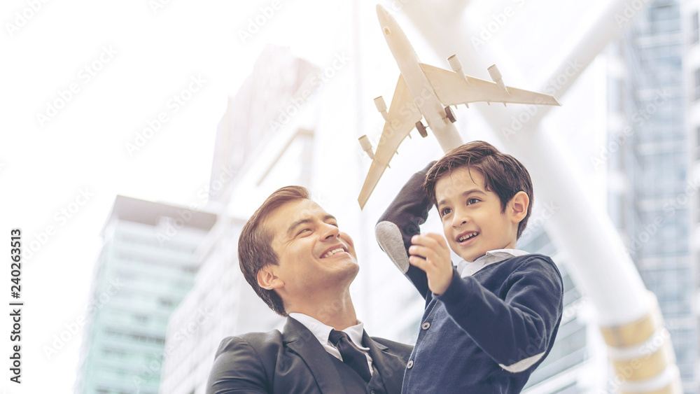 Father carries son playing aviator toy air plane imagination dreaming ...