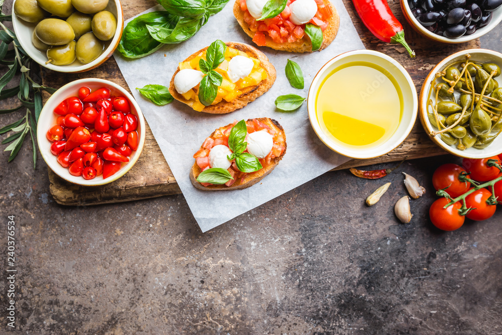 Italian appetizer from above. Mediterranean snack assortment. Black and ...