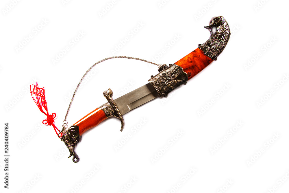 Curved ceremonial dagger knife with a decorative sheath isolated on a ...