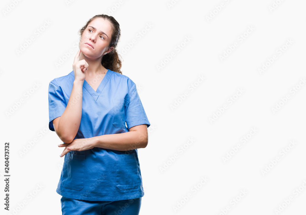 Young brunette doctor girl wearing nurse or surgeon uniform over ...