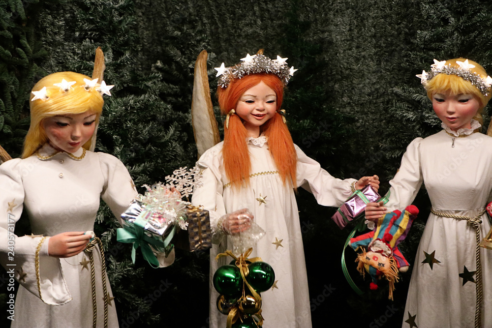 Three mechanical angels with presents and decorations at the ...