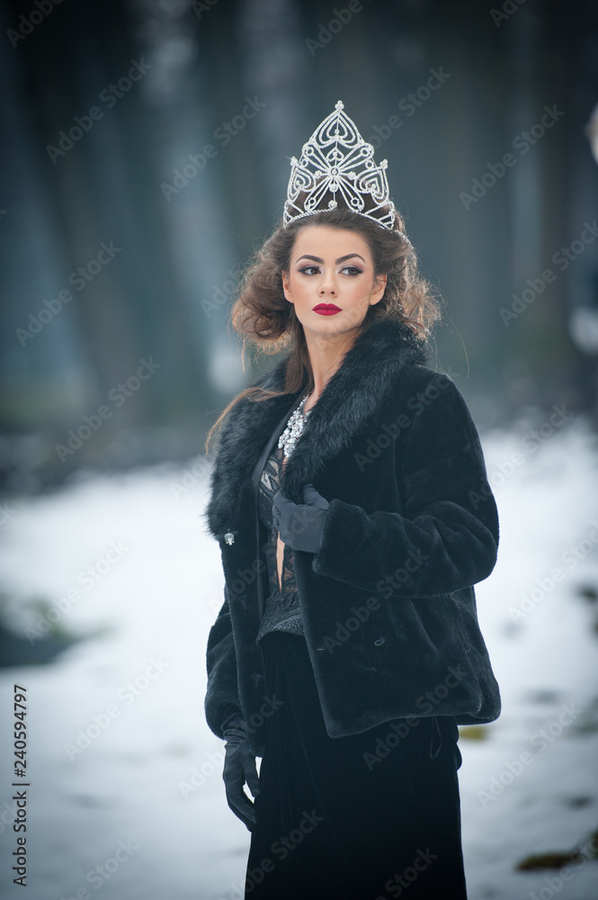 Beautiful fairy-tale winter queen in the forest with sparkling tiara ...