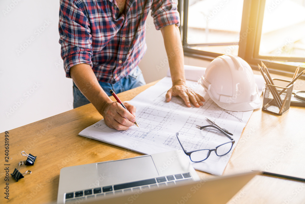 architect or civil engineer during drawing home or building in office ...