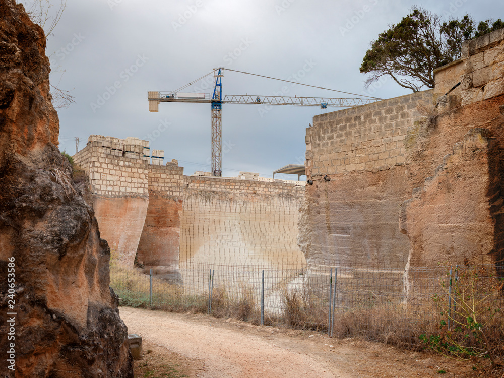 Crane standing in stone quarry Stock Photo | Adobe Stock