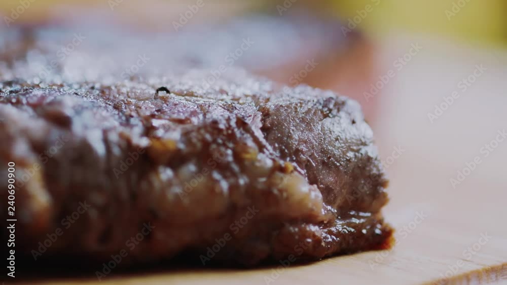Beef steak cooked medium well cut sliced knife on a cutting board roast ...