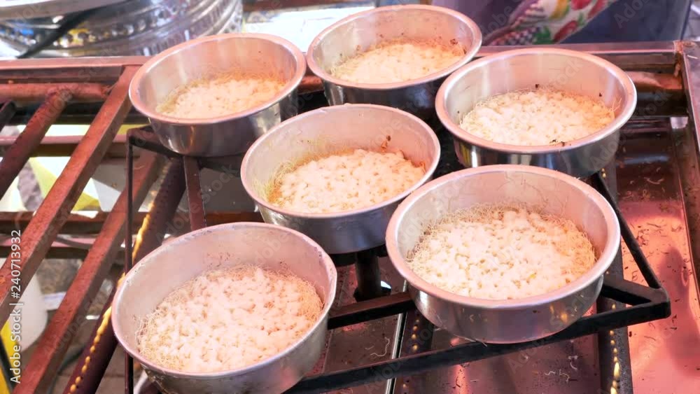 60fps Shot of Hot plates of Kanafeh (Traditional Arab dessert) spinning ...