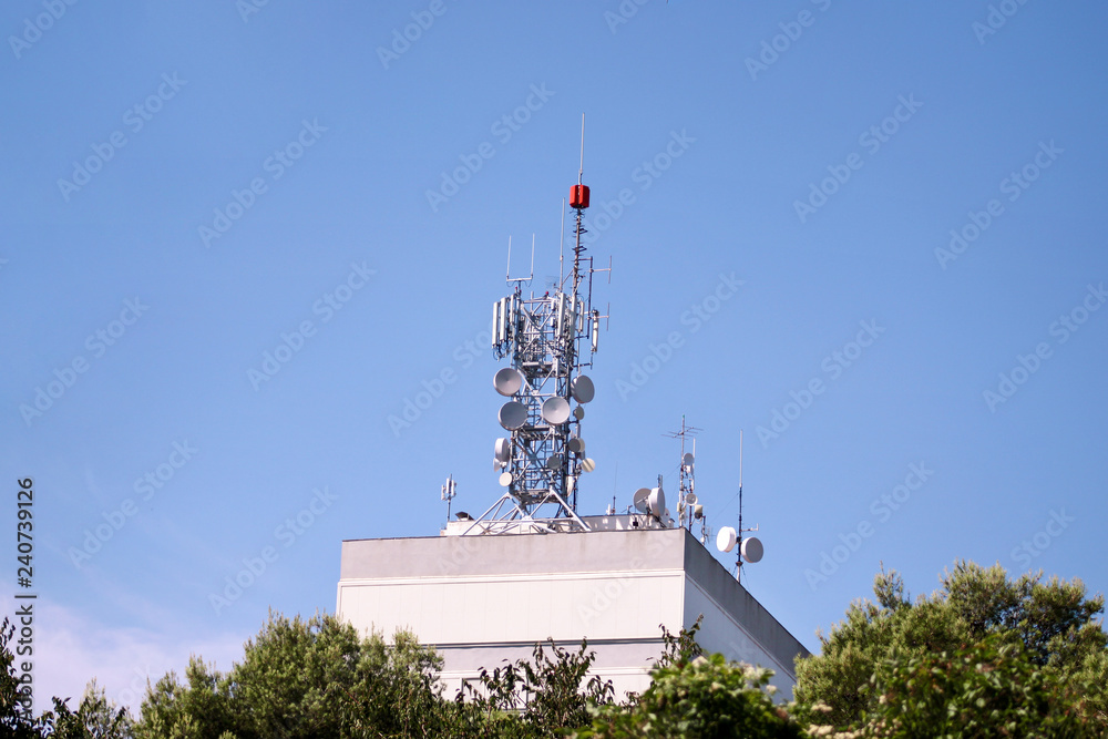 Telecommunication base stations network repeaters on the roof of ...