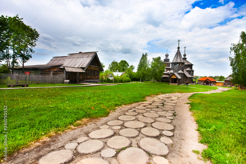 Road to the church.A traditional Russian village, a wooden church, a ...
