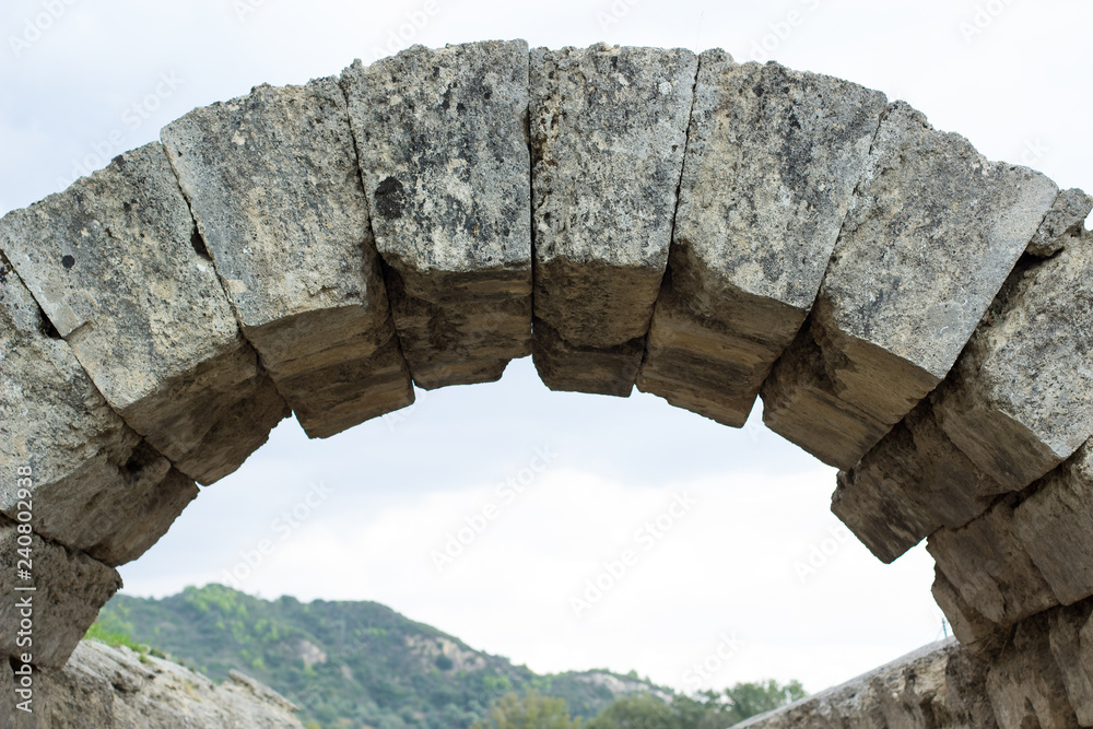 hanging brick stone arch architectural shape object on gray sky ...