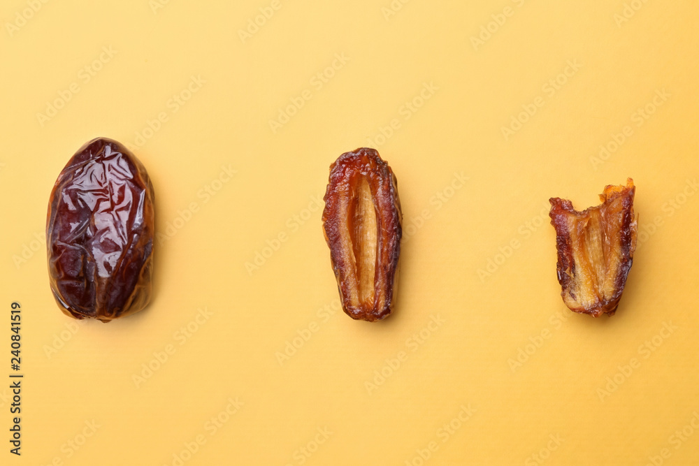 Whole and cut dates on color background Stock Photo | Adobe Stock