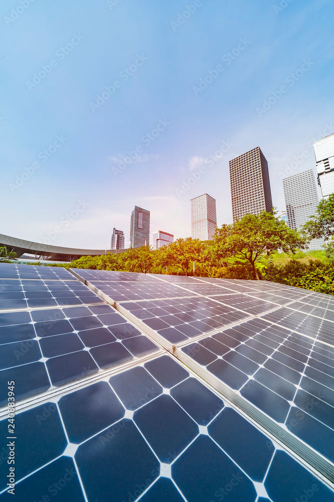 Ecological energy renewable solar panel plant with urban landscape ...