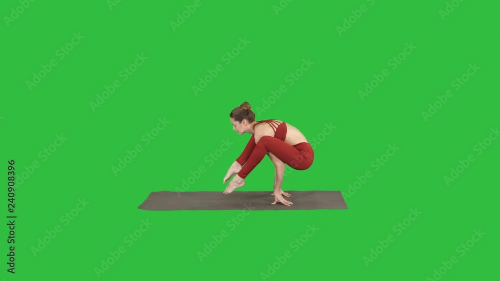 Beautiful woman practices handstand yoga asana Tittibhasana - firefly ...