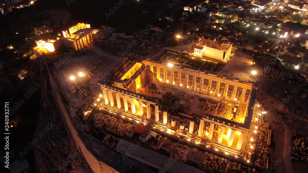 Aerial drone detail night shot of iconic Acropolis hill and the Parthenon a masterpiece of ...