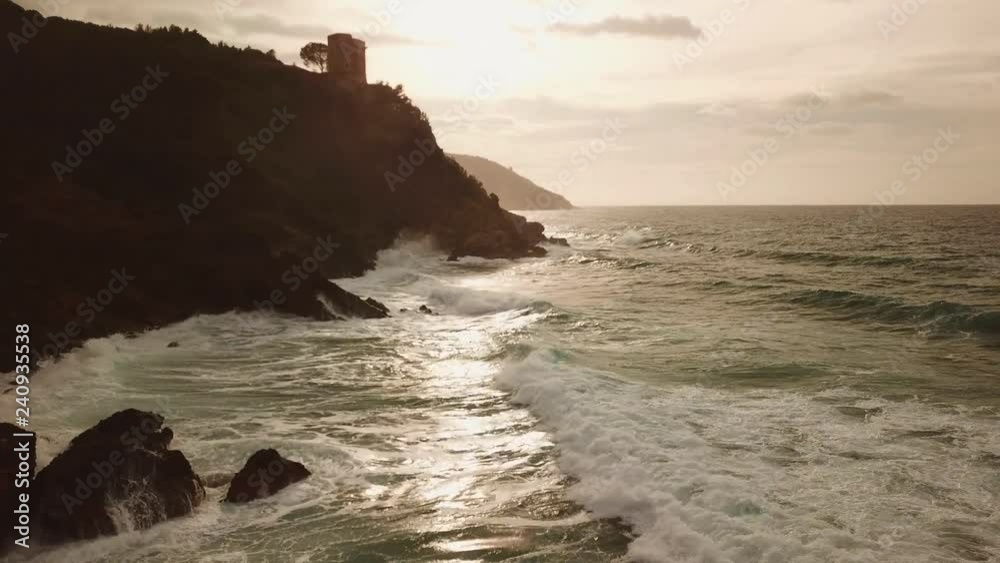 Aerial cinematic view of a lonely bay in a cloudy winter morning with ...