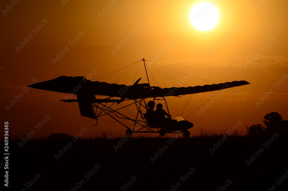 Ultralight airplane at sunset. Ultralight ride. Tranquility in flight ...
