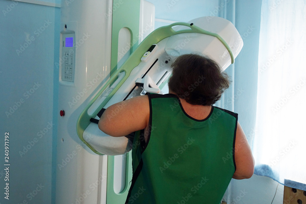 Mammography equipment in the clinic. A woman is conducting a breast ...