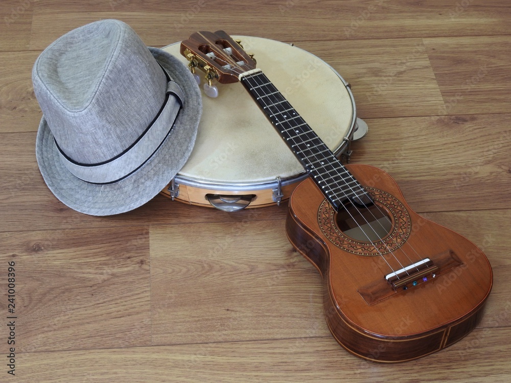 A samba player (sambista) hat and two Brazilian musical instruments ...