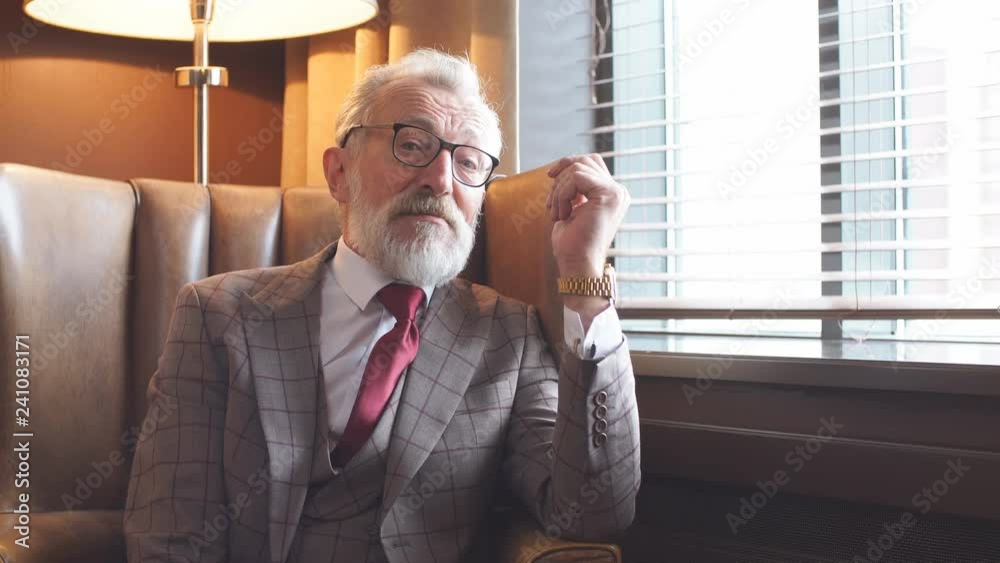Grey haired old male business owner dressed in formal wear and ...