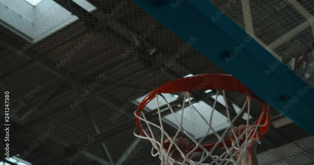 High school team basketball player practicing dunks indoors. 4K UHD ...